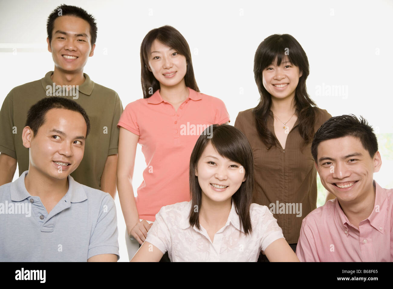 Office workers smiling together Stock Photo - Alamy