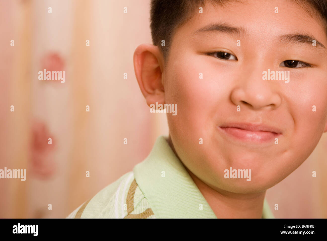 Portrait of a boy smirking Stock Photo - Alamy