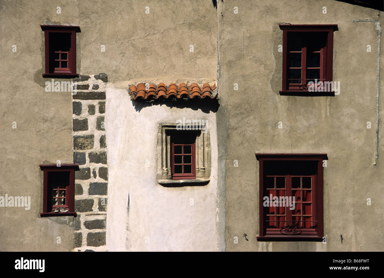 Medieval window patterns and facade, Le Puy-en-Velay, France Stock ...