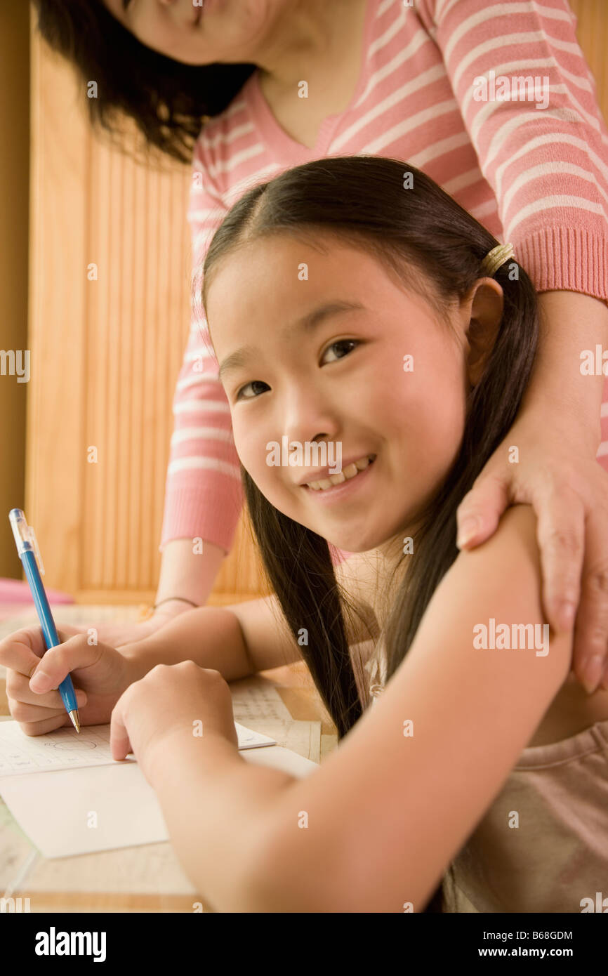 Girls hand holding pen writing hi-res stock photography and images - Alamy