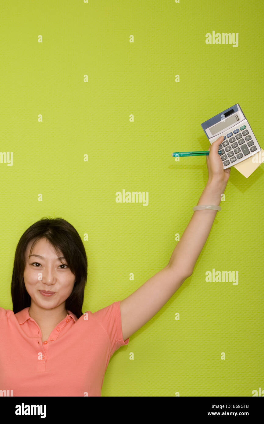 Portrait of a female office worker holding stationery objects Stock ...