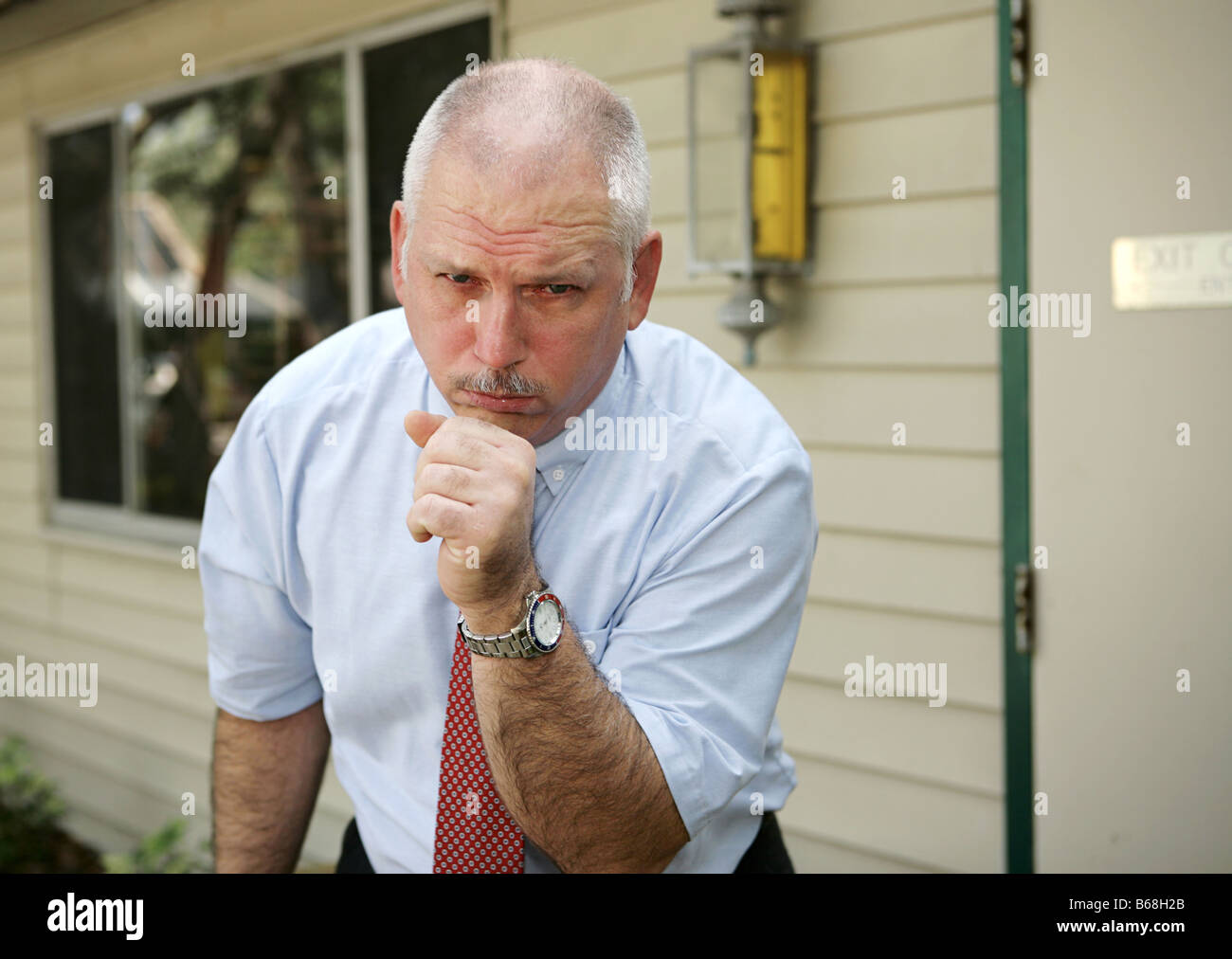 A businessman coughing with a severe chest cold Stock Photo - Alamy