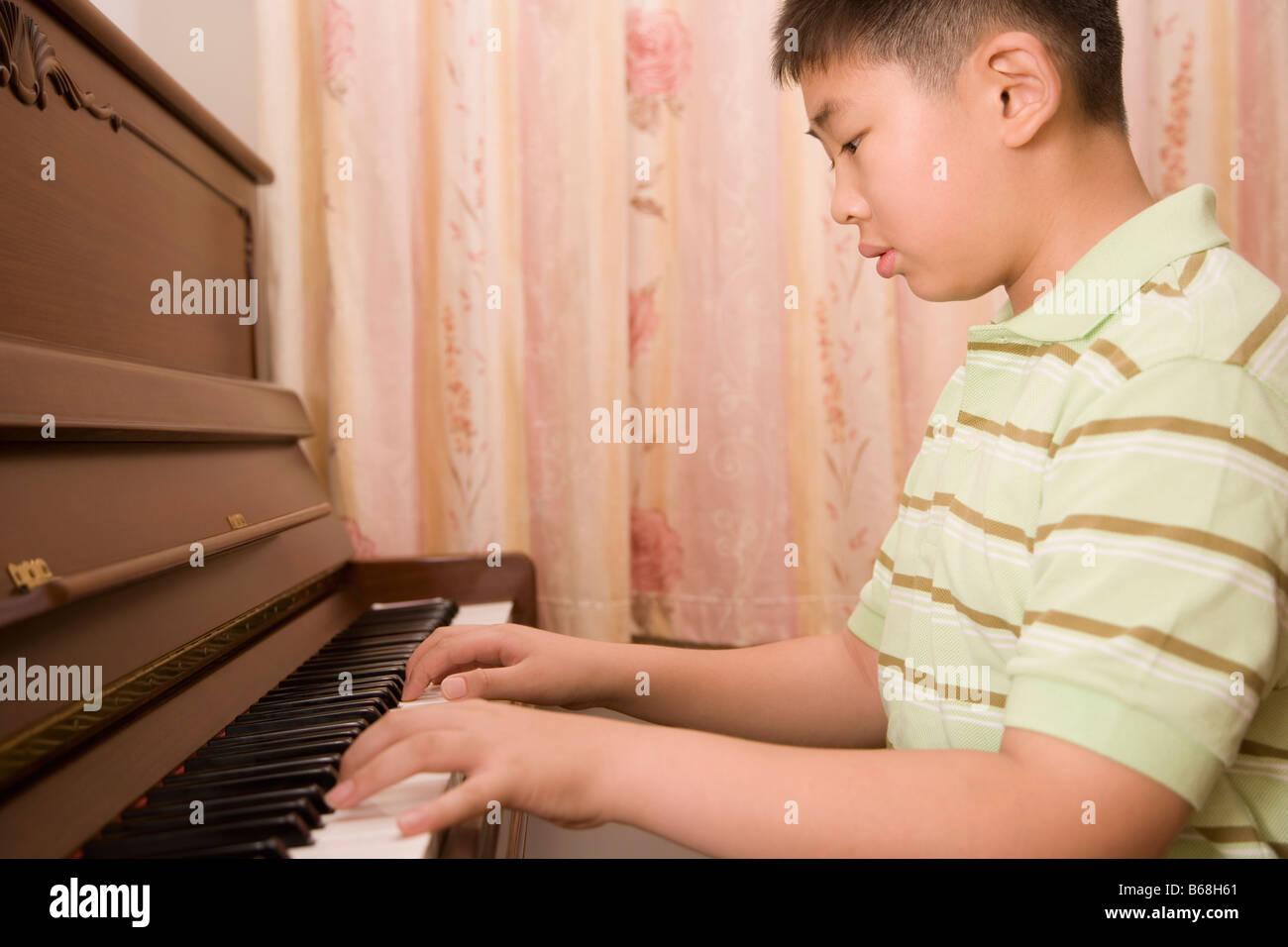 Chinese kids playing musical instrument hi-res stock photography and ...