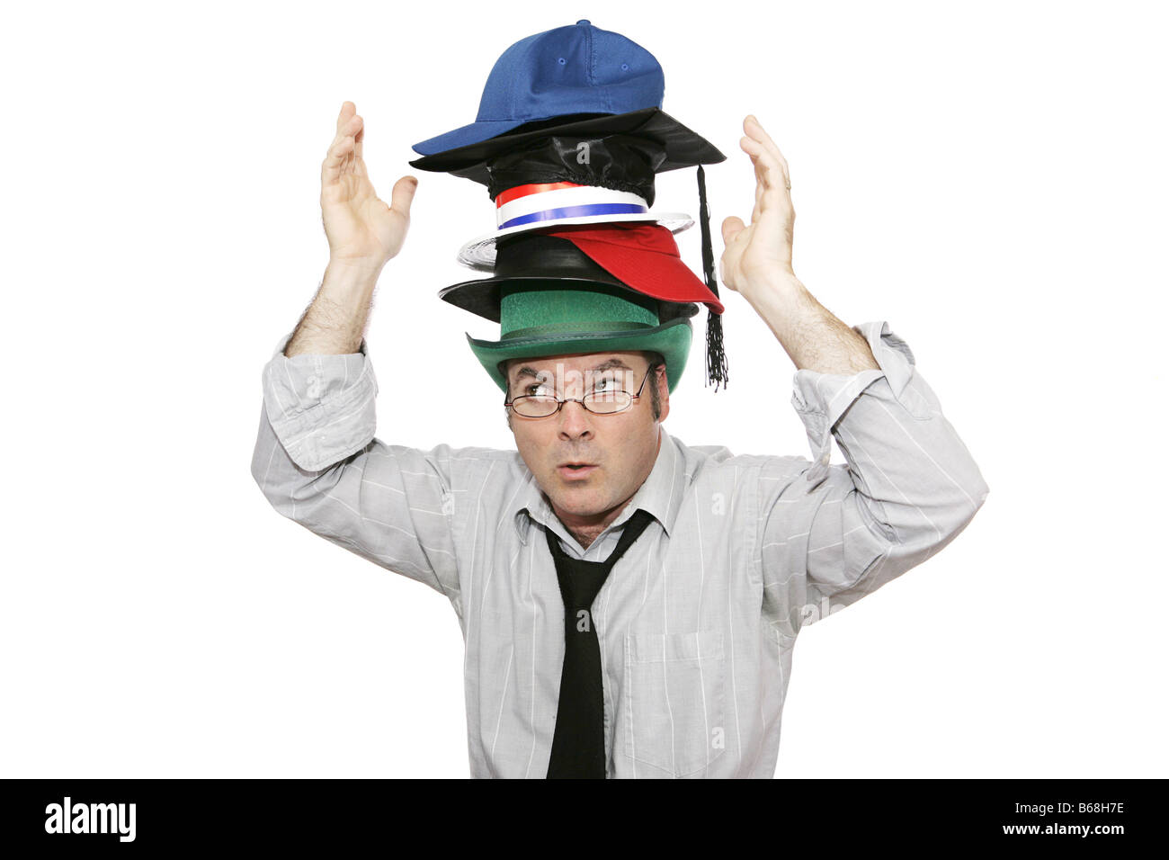 Business people wearing many hats hi-res stock photography and images ...