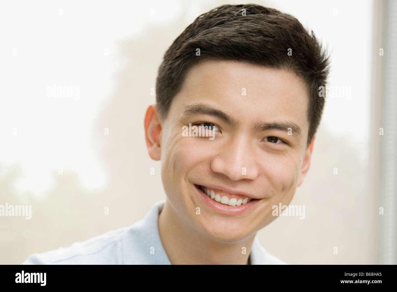 Portrait of a male office worker smiling Stock Photo - Alamy