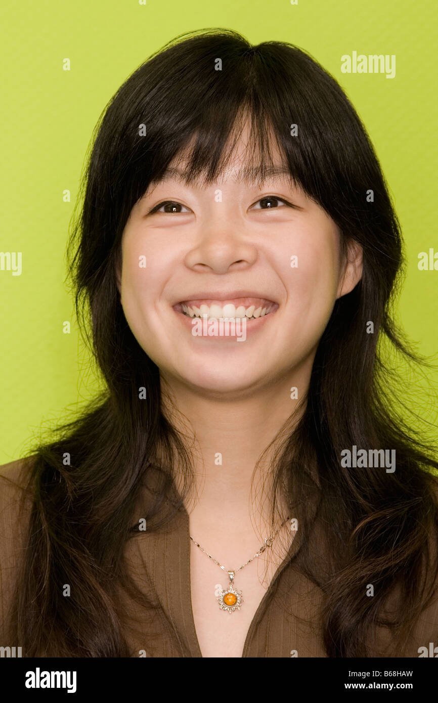 Close-up of a female office worker smiling Stock Photo - Alamy