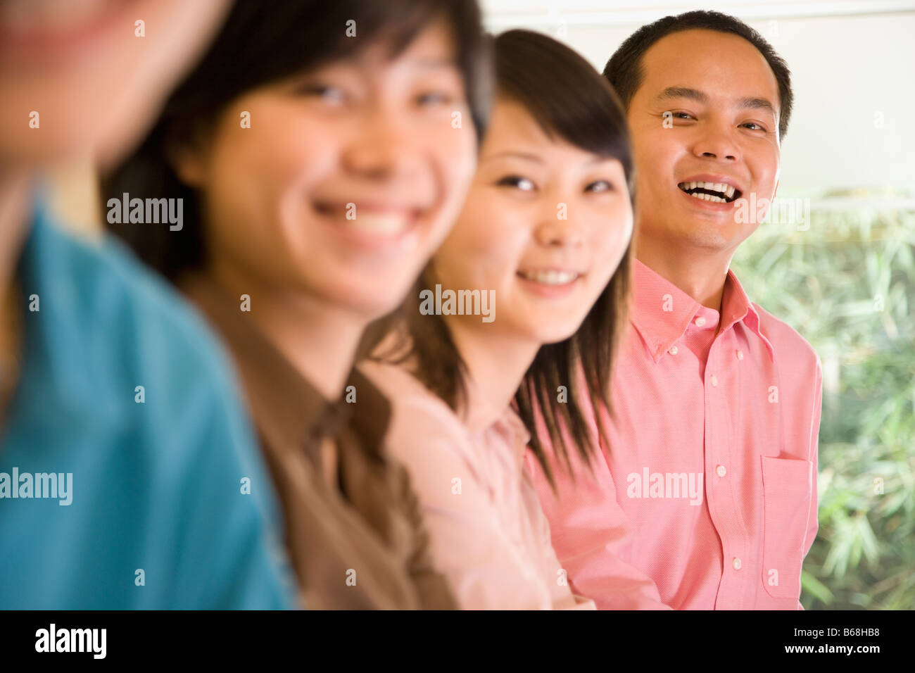 Four office workers in a row Stock Photo - Alamy
