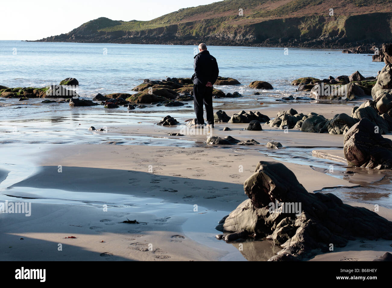 A man is looking at the ocean Stock Photo - Alamy