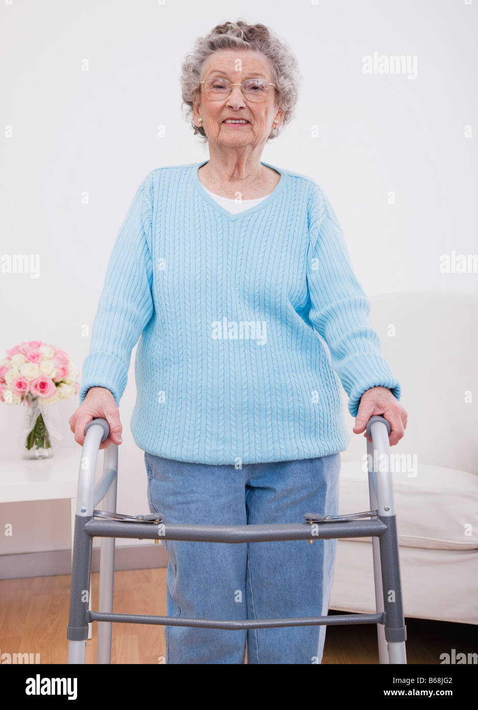 Portrait of senior woman with walker Stock Photo - Alamy