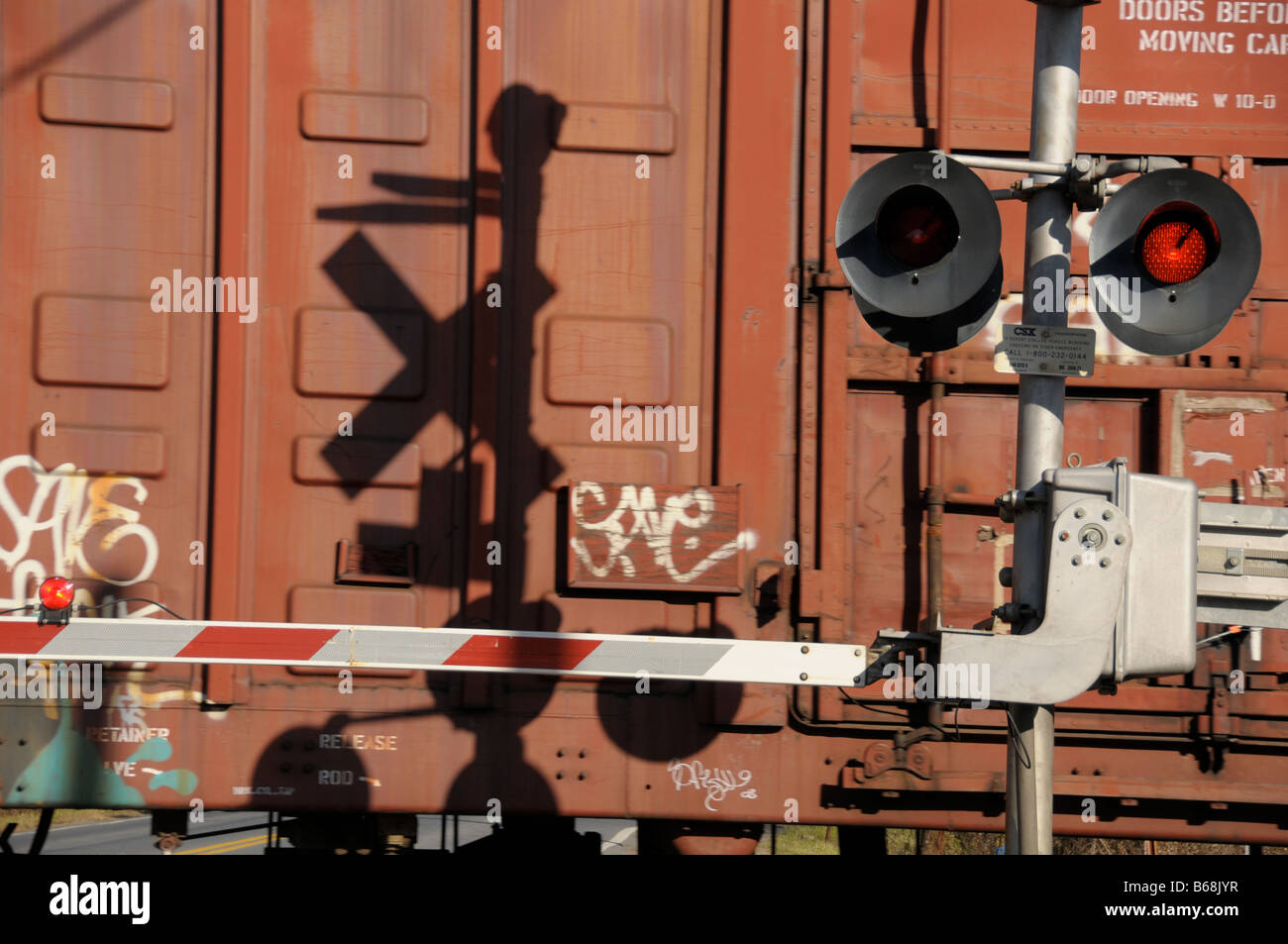 Train speeding past railroad crossing hi-res stock photography and ...