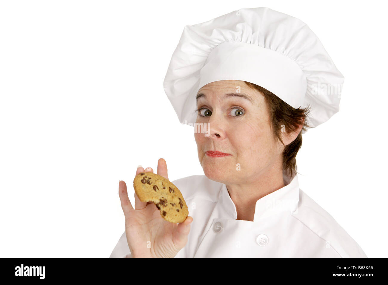 Chef eating one of the chocolate chip cookies she just baked Isolated ...