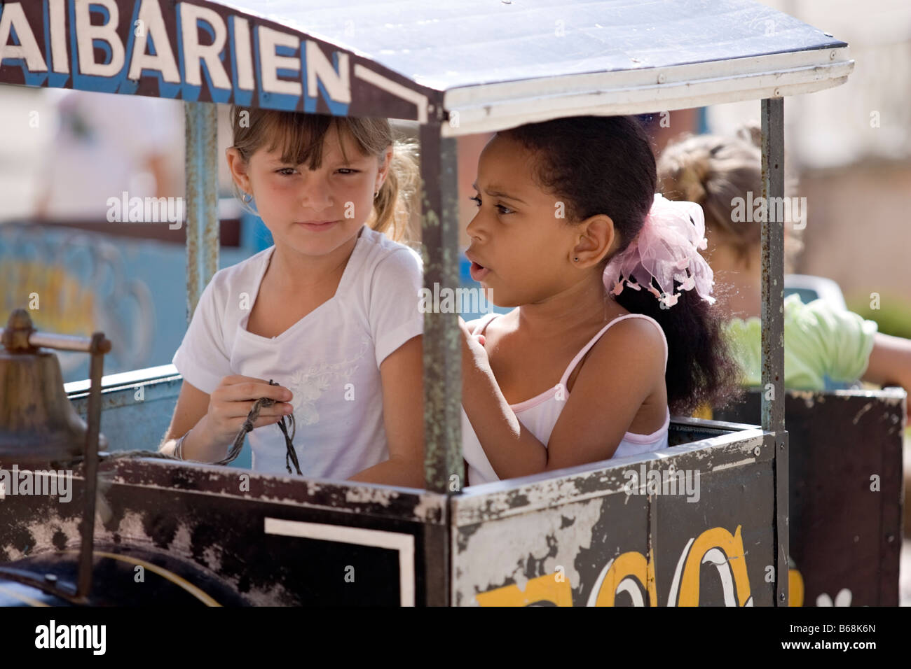 Cuban children play at the amusement park. Remedios, Cuba. Caribbean ...