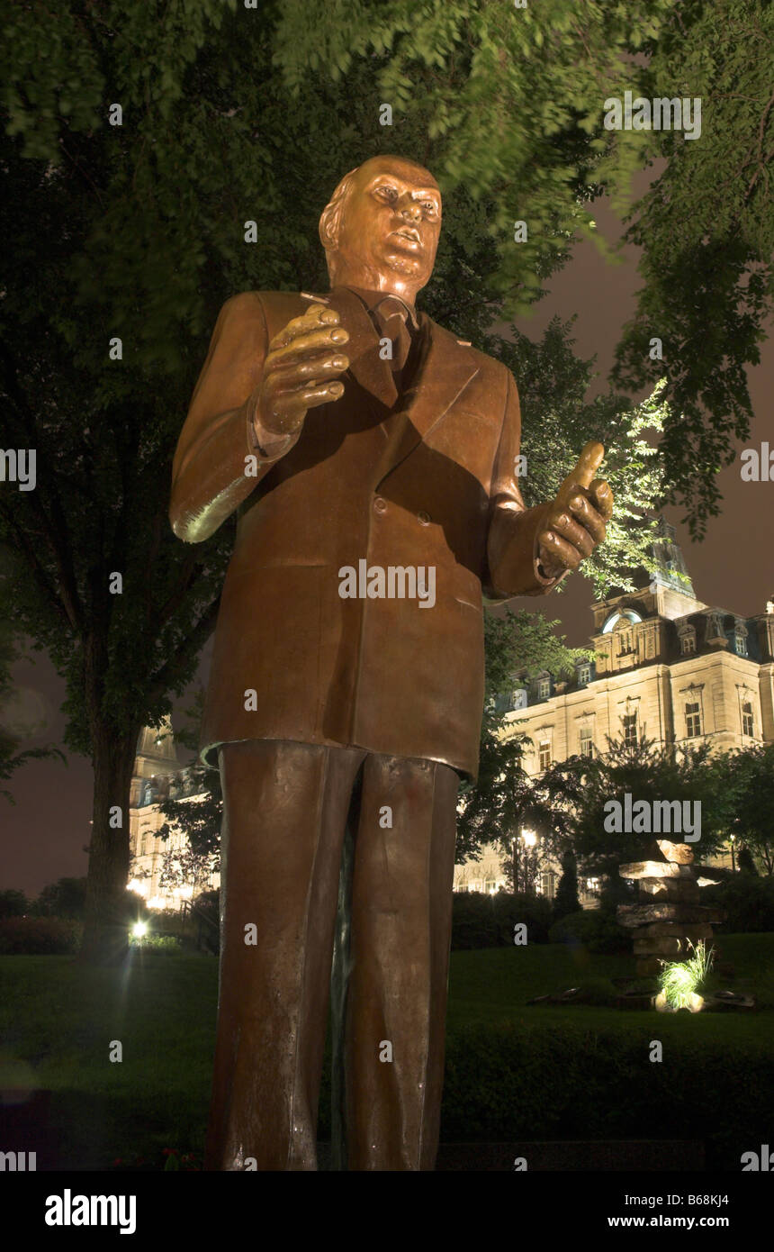 A statue of Quebec prime minister Rene Levesque at night Stock Photo ...