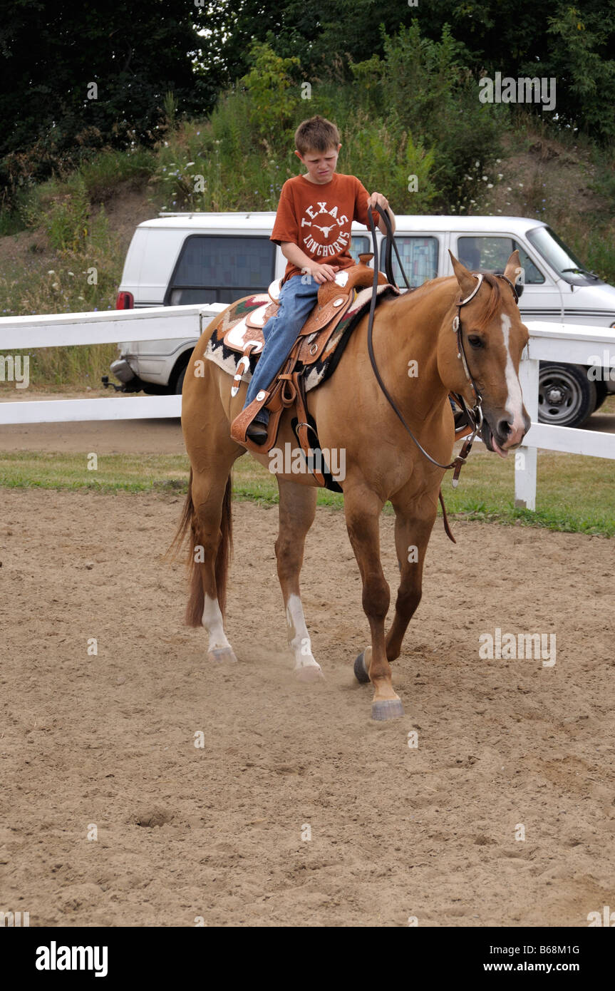 Boy riding a horse in Bellville, Michigan Stock Photo - Alamy