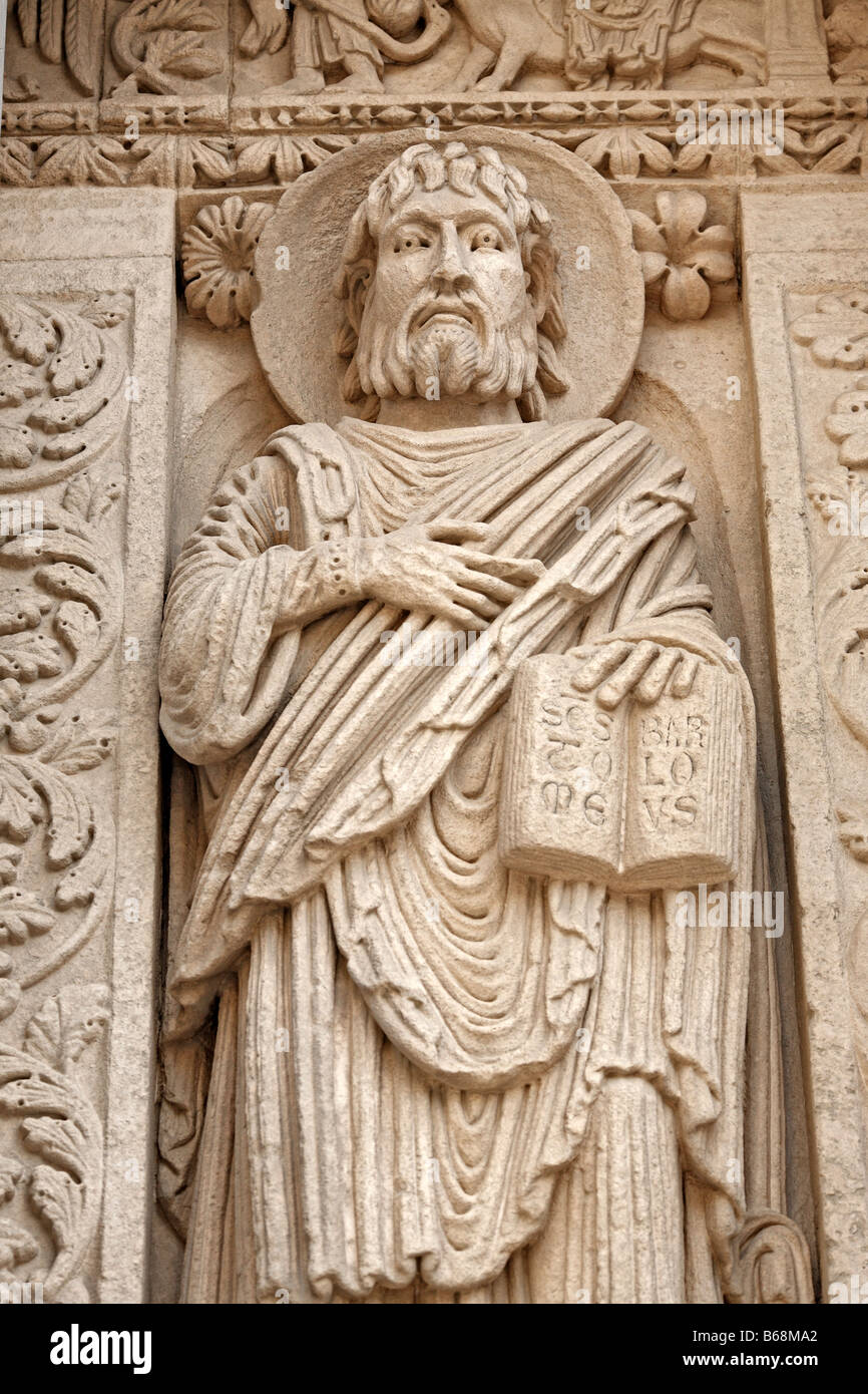 Romanesque stone bas relief on portal of the Saint Trophimus cathedral ...