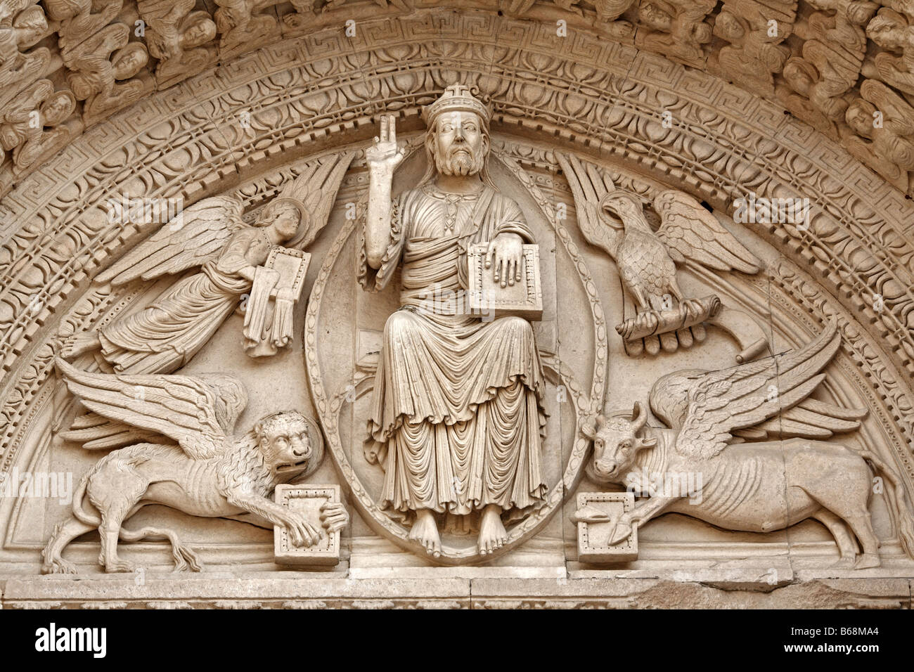 Romanesque stone bas relief on portal of the Saint Trophimus cathedral ...