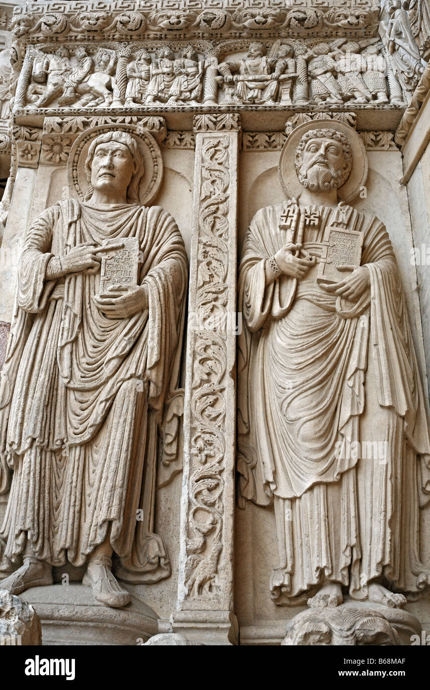 Romanesque stone bas relief on portal of the Saint Trophimus cathedral ...