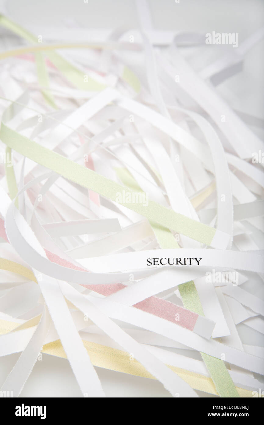 Shredded paper One shred showing the word security Stock Photo - Alamy