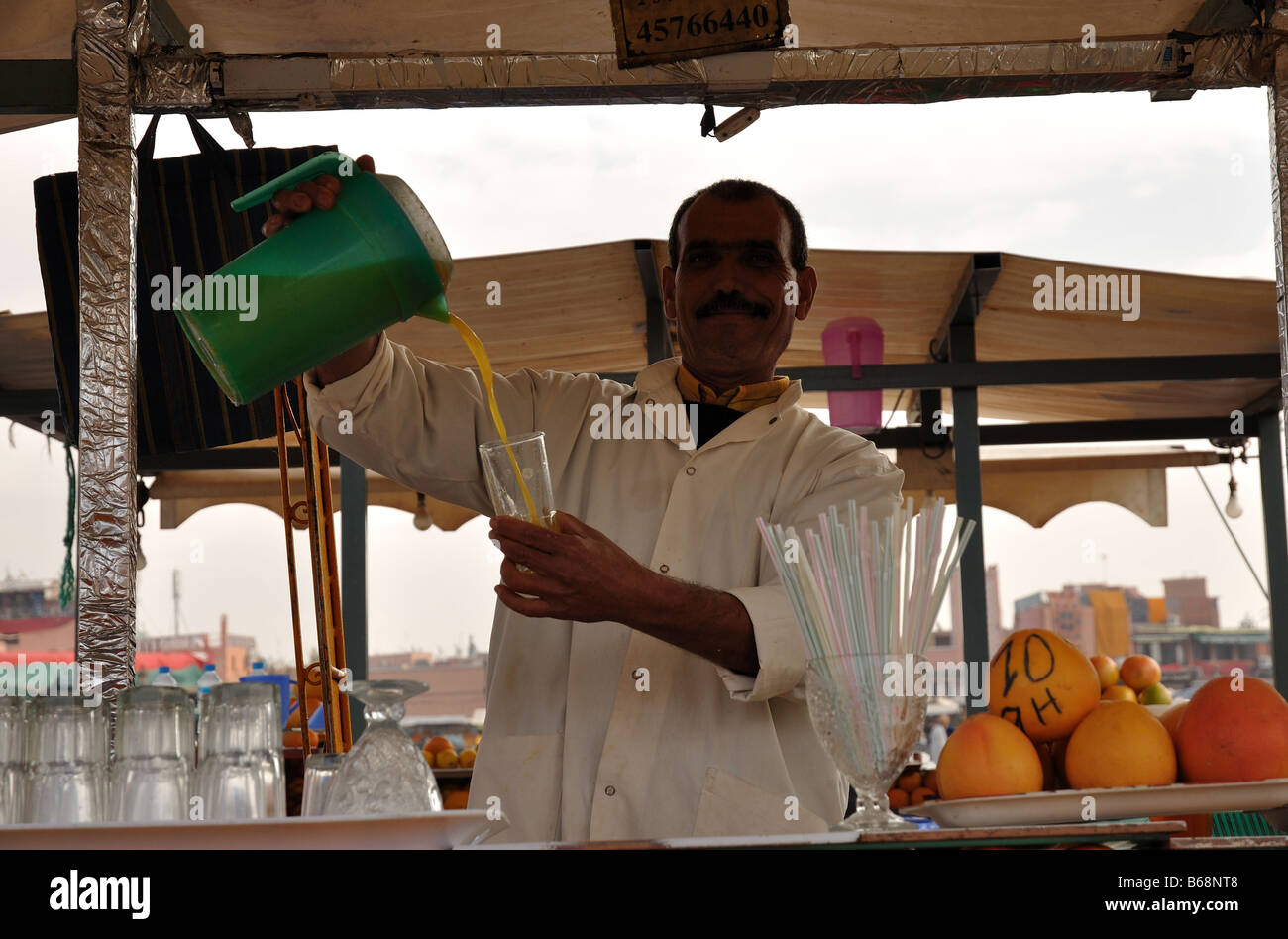 Orange juice seller on Jamaa el Fna square in Marrakech, Morocco Stock ...