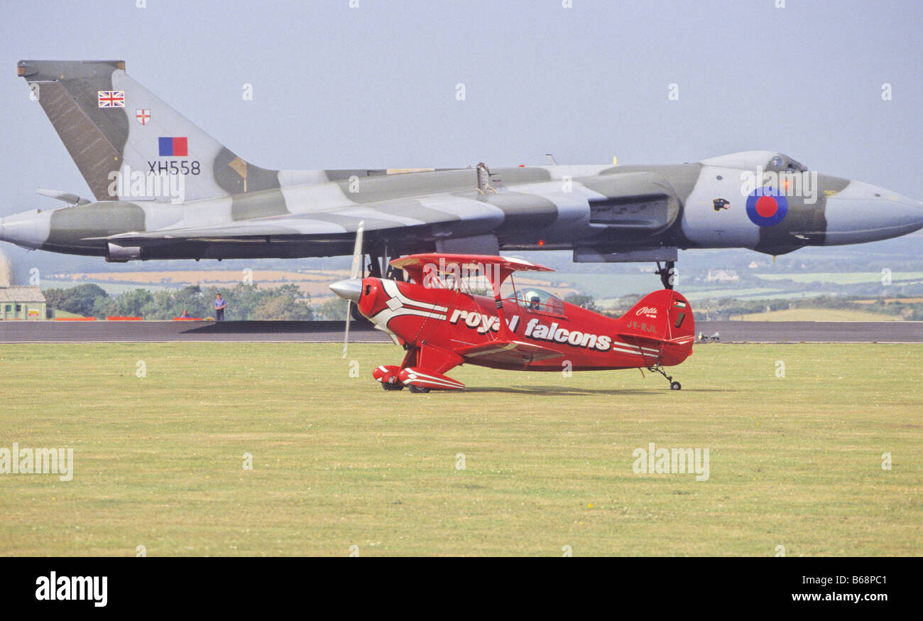 vulcan bomber taking off with small red stunt plane in foreground Stock ...