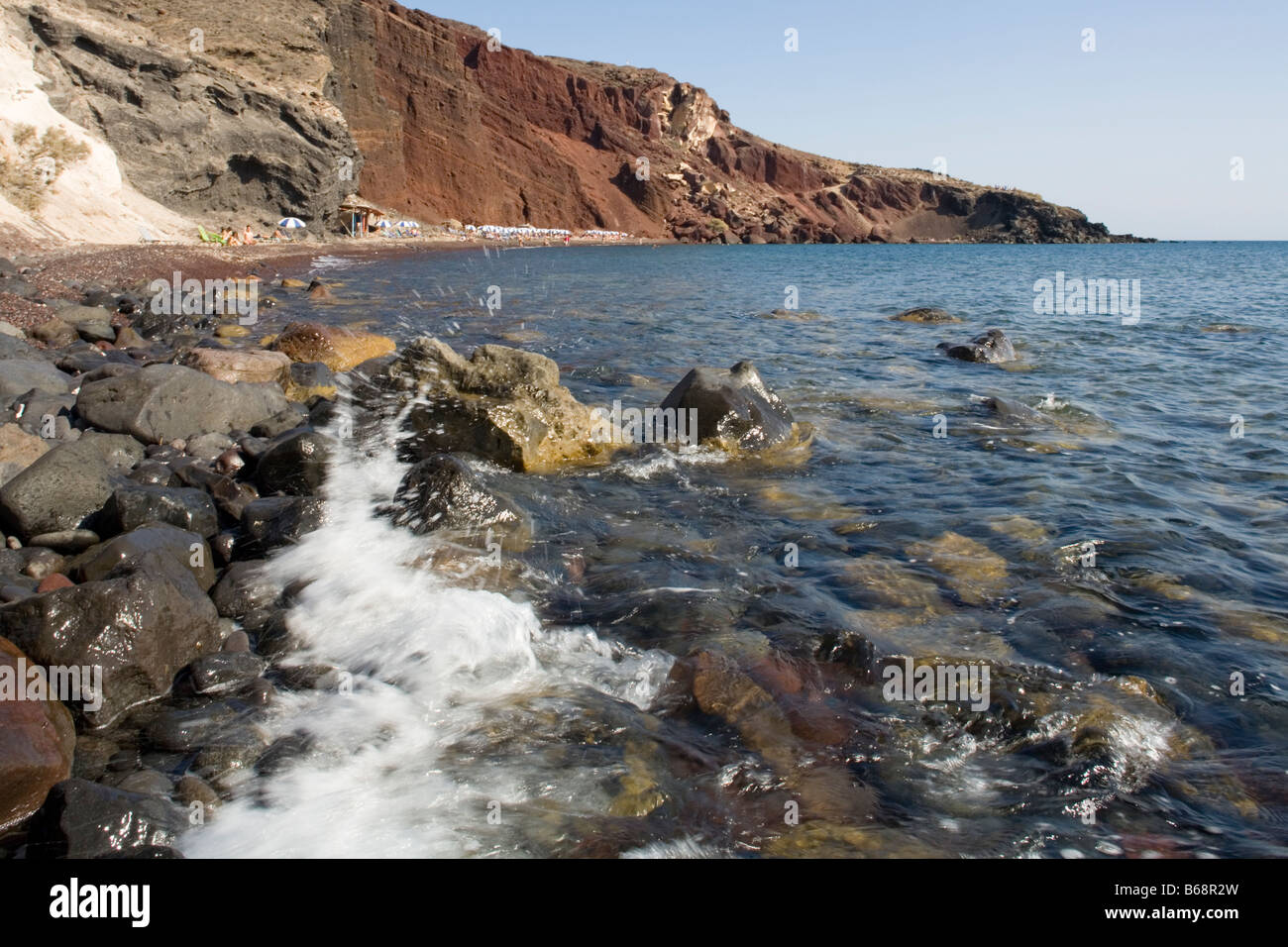 Waves crashing at Santorini's red beach Stock Photo - Alamy