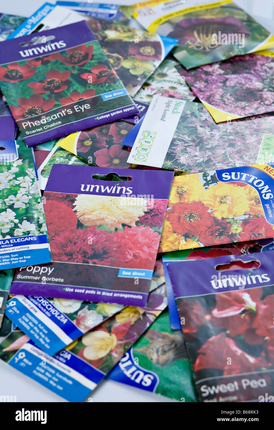 Several flower seed packets ready to be opened and sown Stock Photo - Alamy