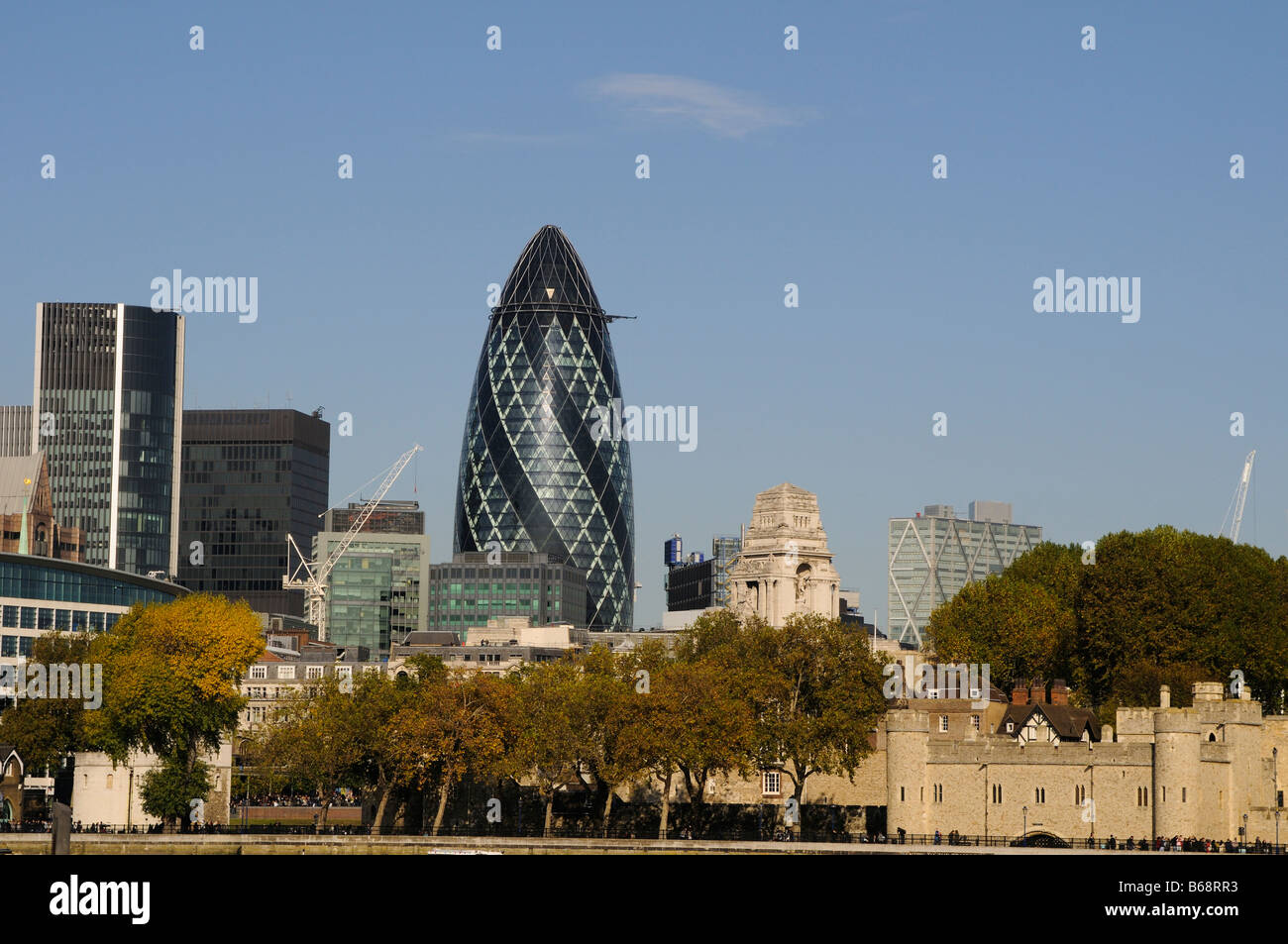 Swiss Re Building Gherkin and Tower of London London UK Stock Photo - Alamy