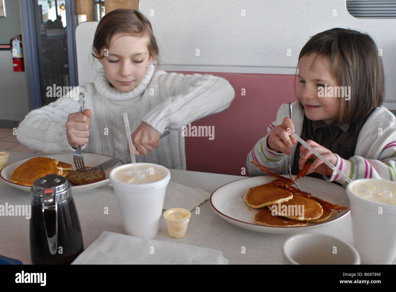 Kids eating at the diner Stock Photo - Alamy