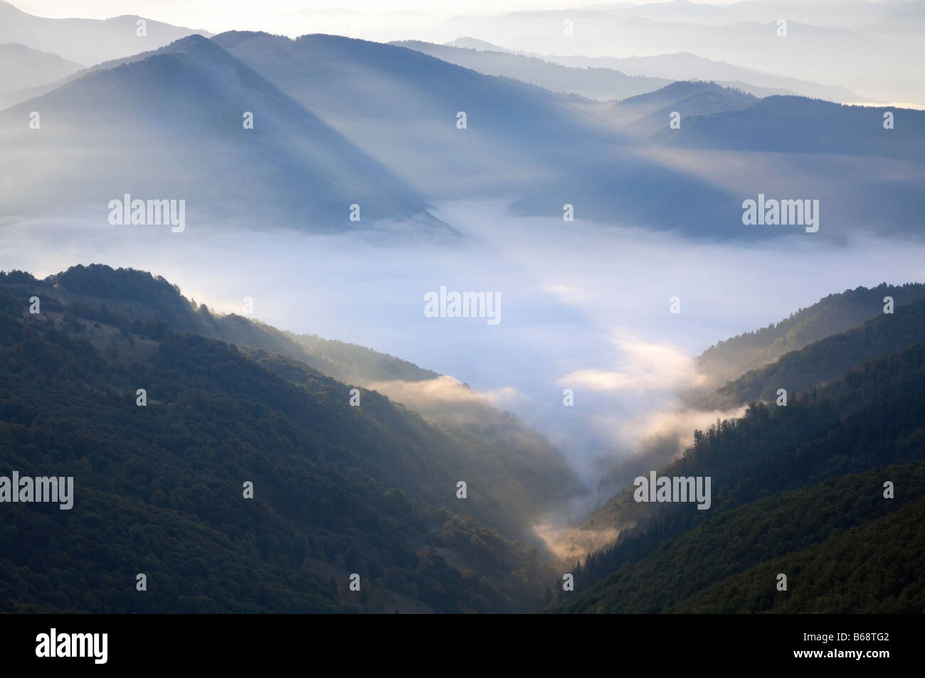 Autumn morning mountain view with sunbeam and haze Stock Photo - Alamy