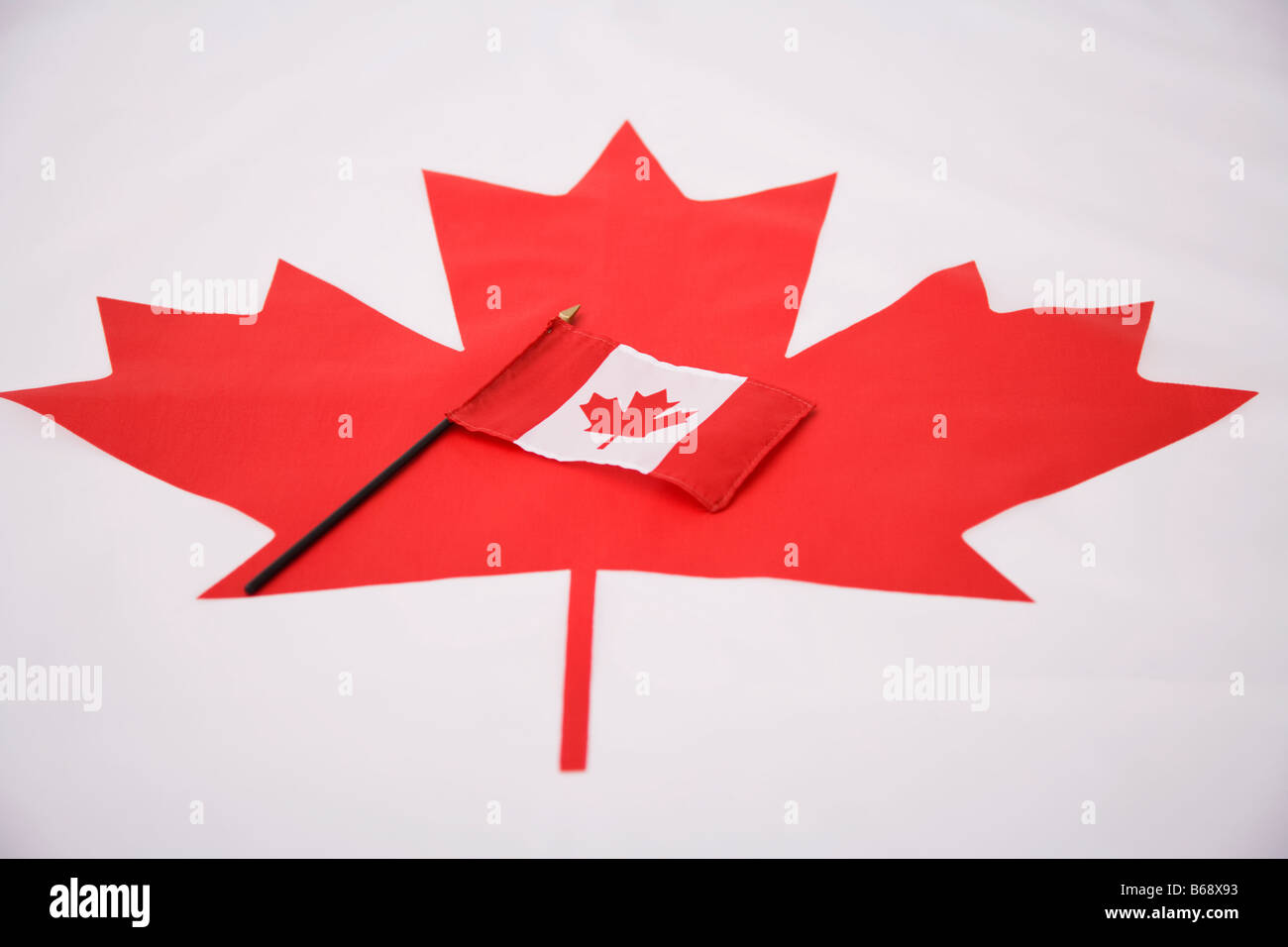Canadian flag on large maple leaf symbol Stock Photo - Alamy