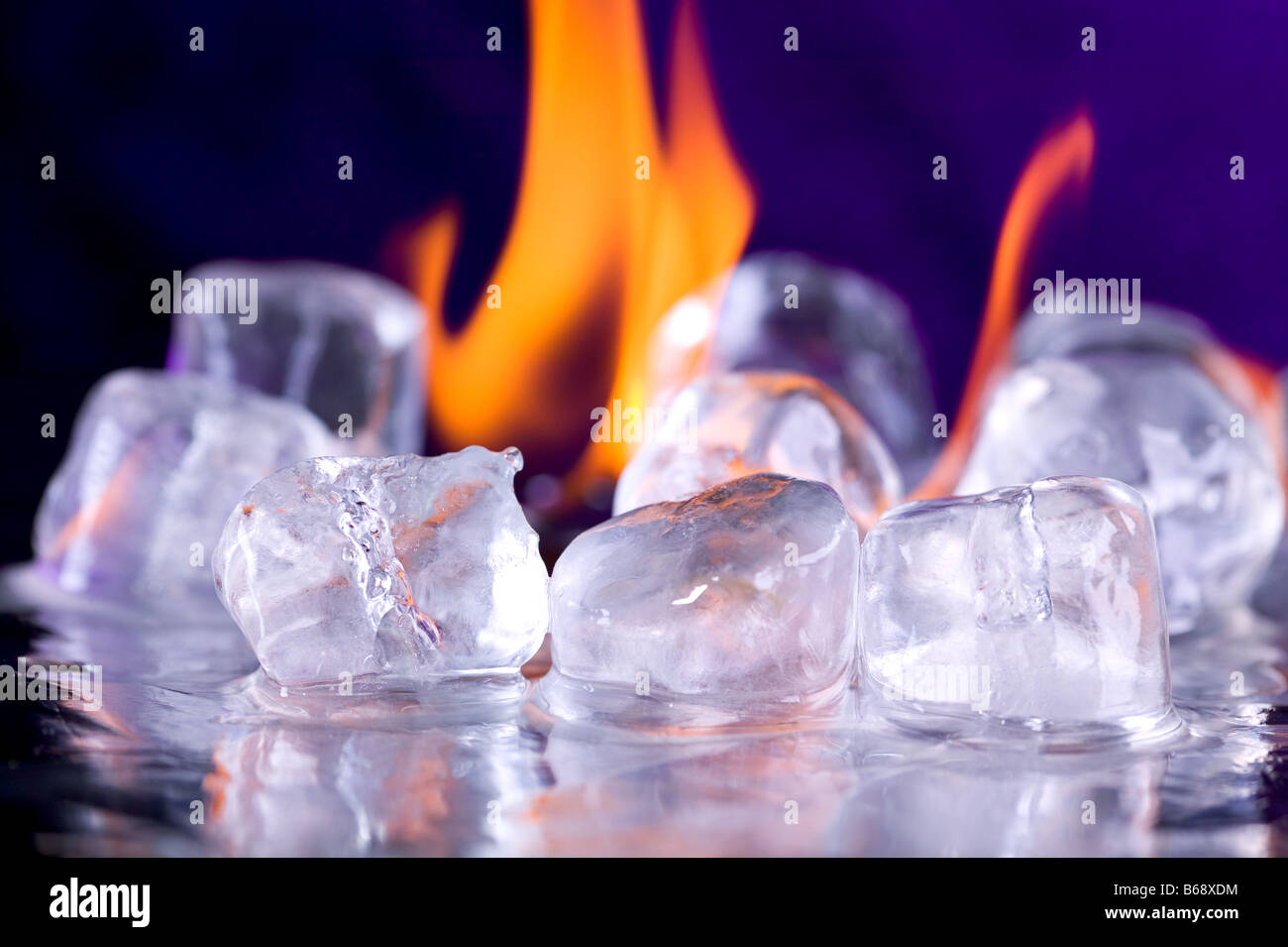 Ice cubes melt surrounded by flames Stock Photo - Alamy