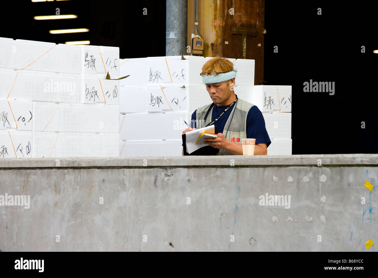 Man counting boxes at The Tsukiji Fish Market in Tokyo, Japan Stock ...