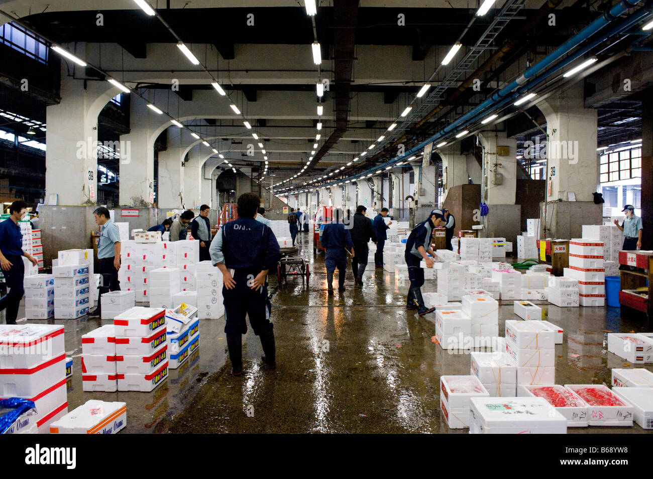 Workers in the loading area at The Tsukiji Fish Market in Tokyo, Japan ...