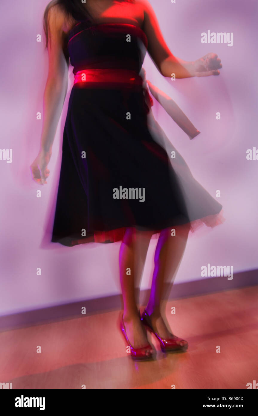 Woman dancing on purple background Stock Photo - Alamy