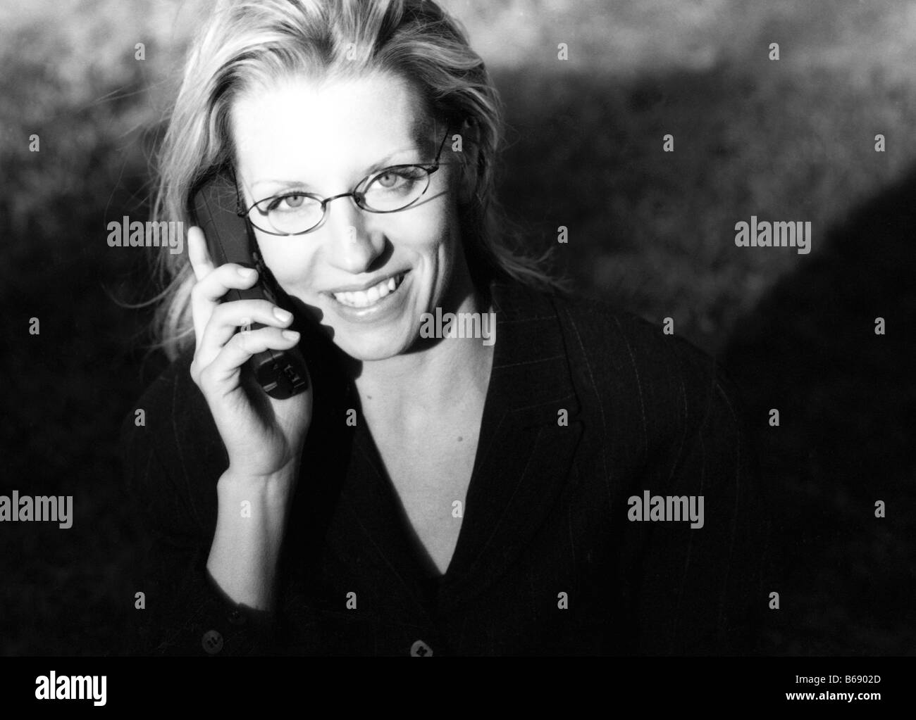 Mobile communication portrait lady using Black and White Stock Photos ...