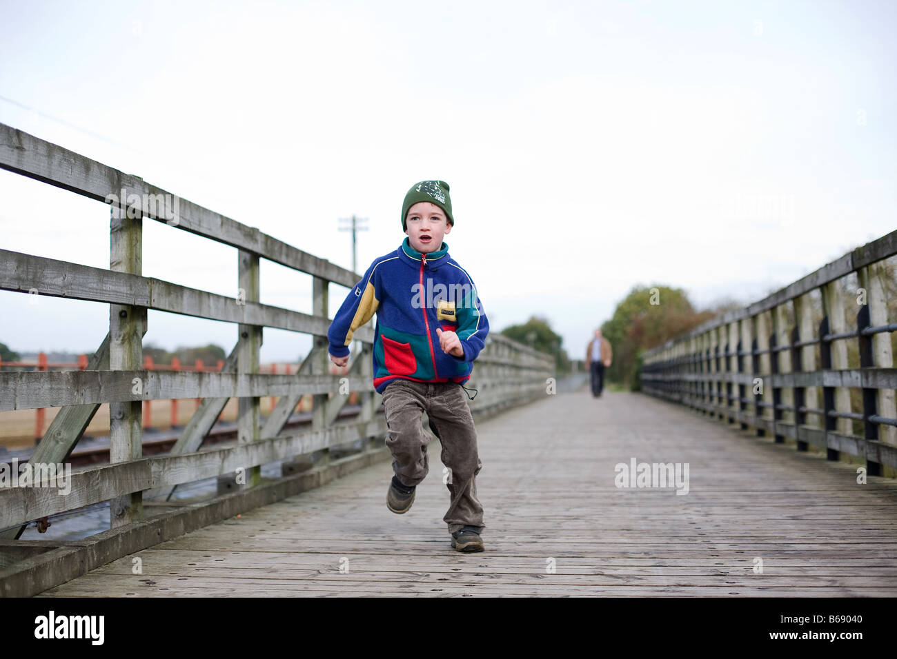 Two boys race over a bridge in Northamptonshire MODEL RELEASE AVAILABLE ...