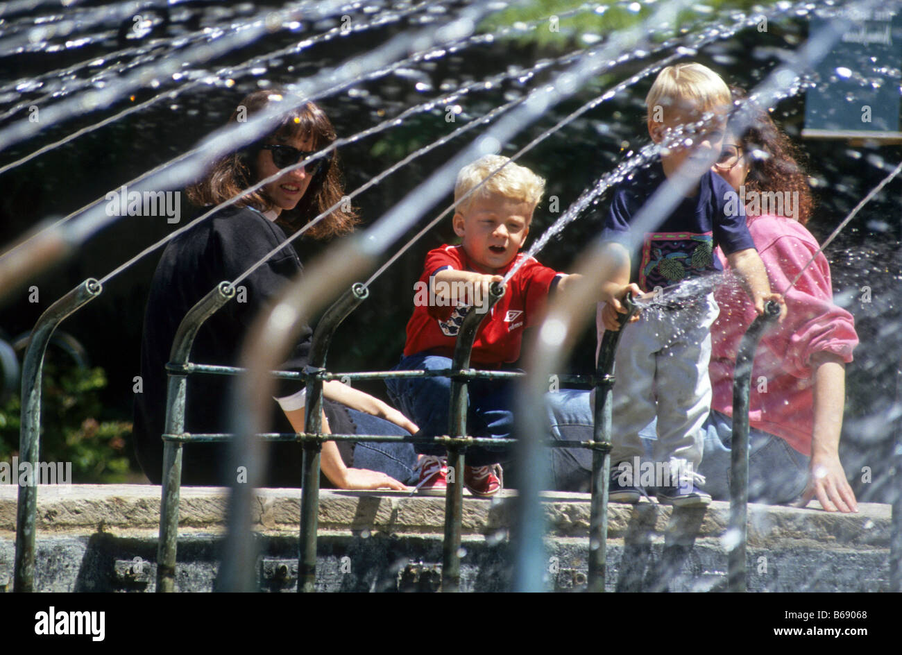 Children play with fountain Stock Photo - Alamy