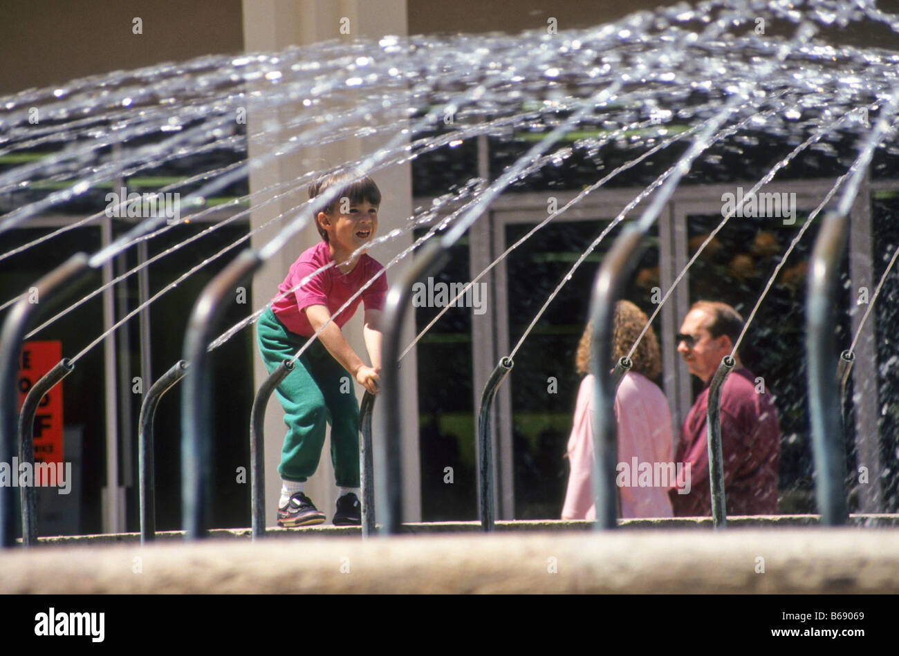 Children play with fountain Stock Photo - Alamy