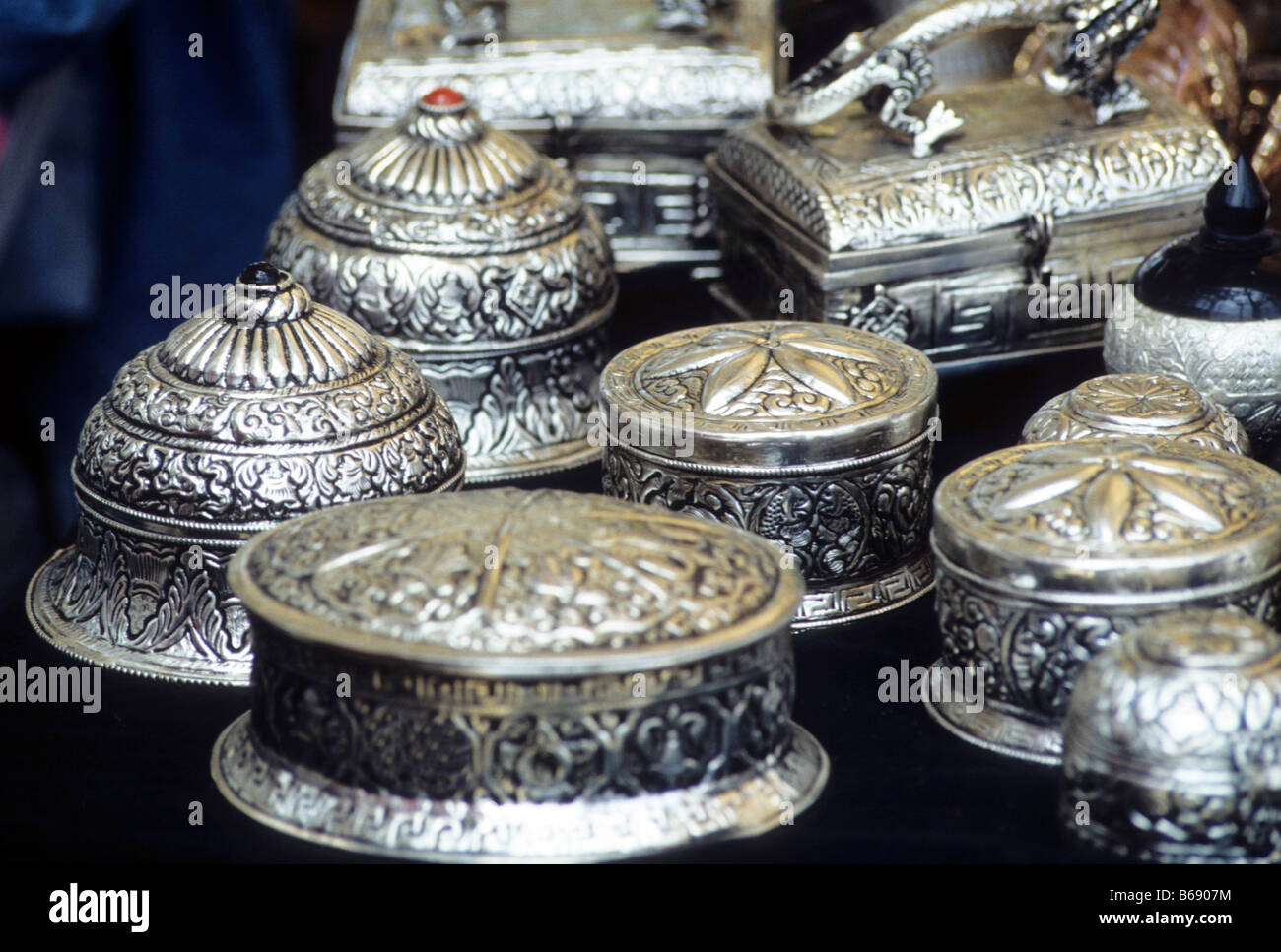 Variety of silver containers with embossed patterns Stock Photo - Alamy