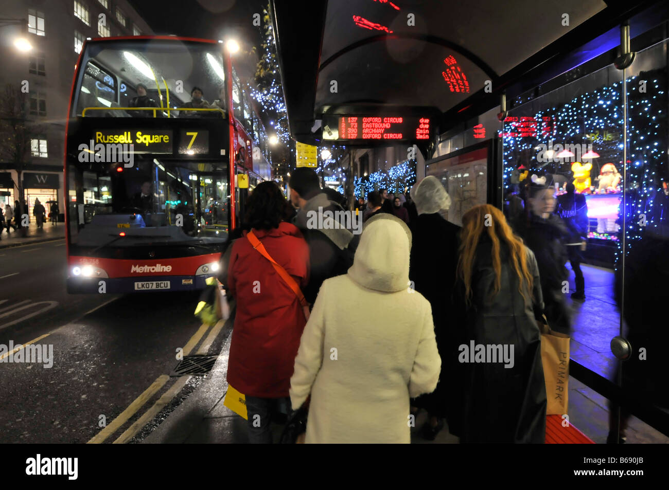 Oxford street bus stop and bus with electronic timetable bus driver ...