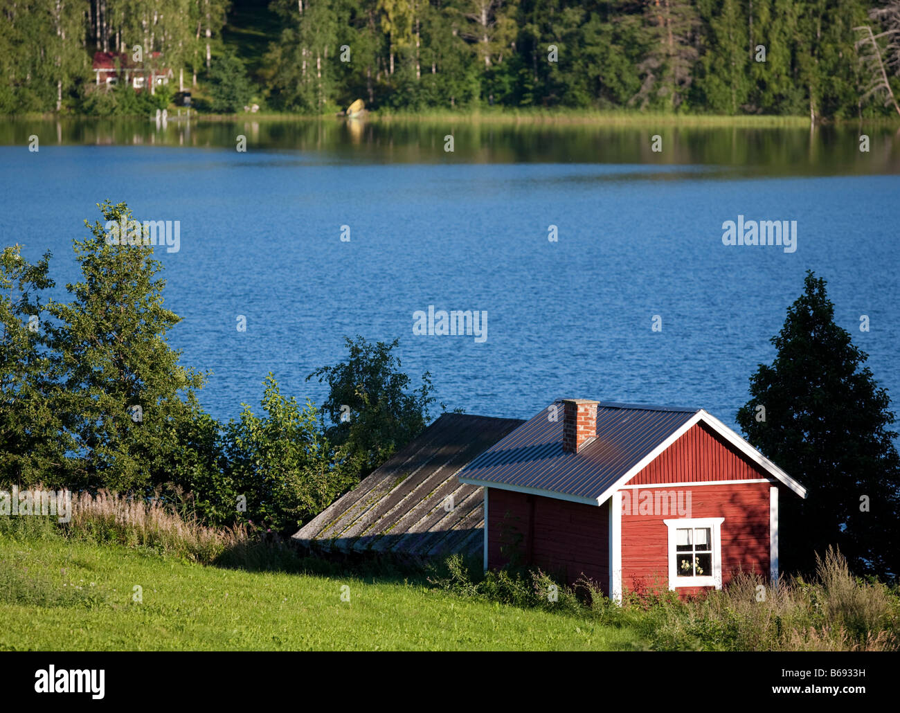 Old small red wooden sauna cabin by a lake , Finland Stock Photo - Alamy