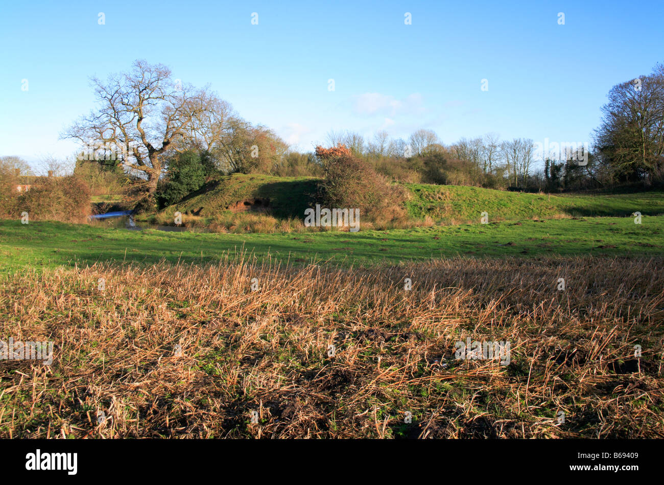Earthworks and moat at Norman motte and bailey castle at Mileham ...