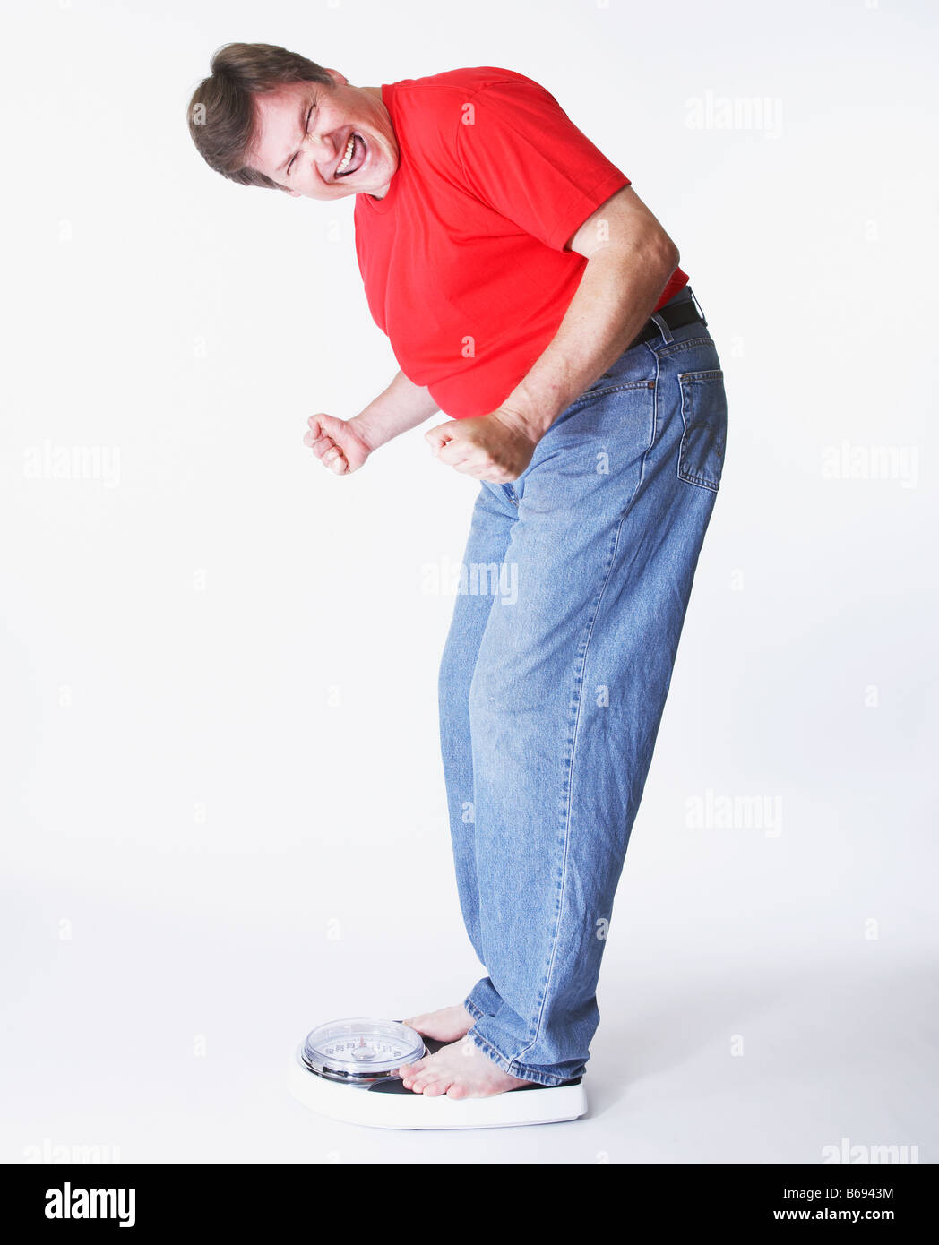 Overweight man standing on scales hi-res stock photography and images ...