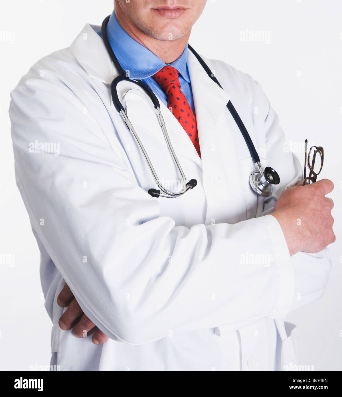 Male doctor with stethoscope around neck, mid section Stock Photo - Alamy