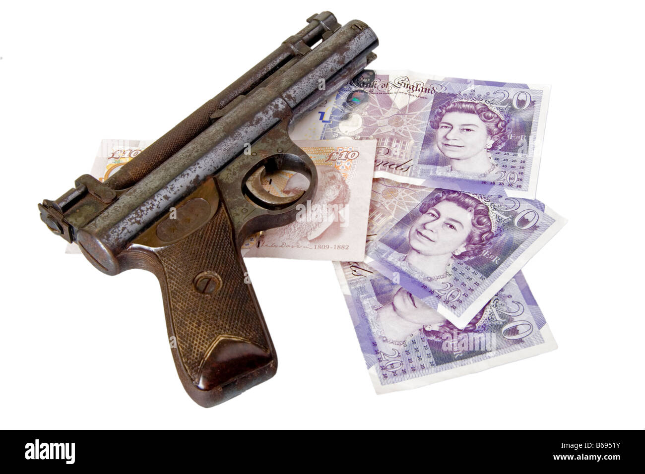 Handgun and English bank notes Stock Photo - Alamy