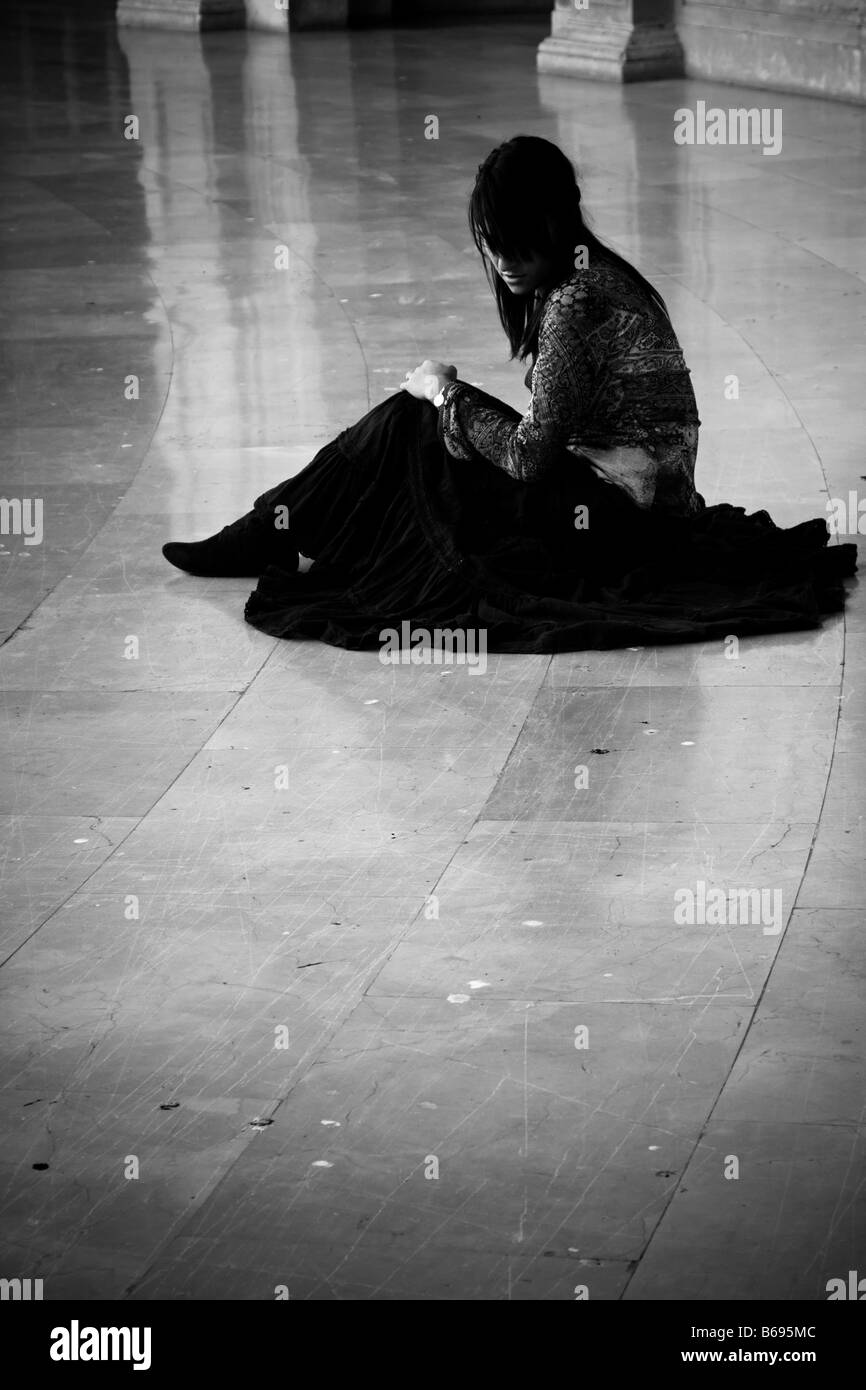 Sad elegant woman sitting and crying Stock Photo - Alamy