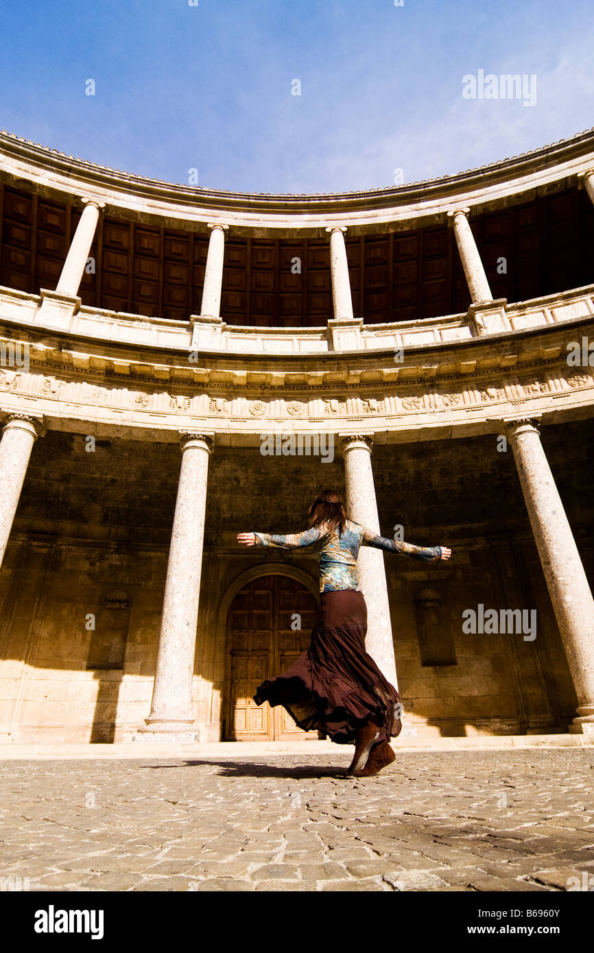 Happy young woman dancing in monumental building Stock Photo - Alamy