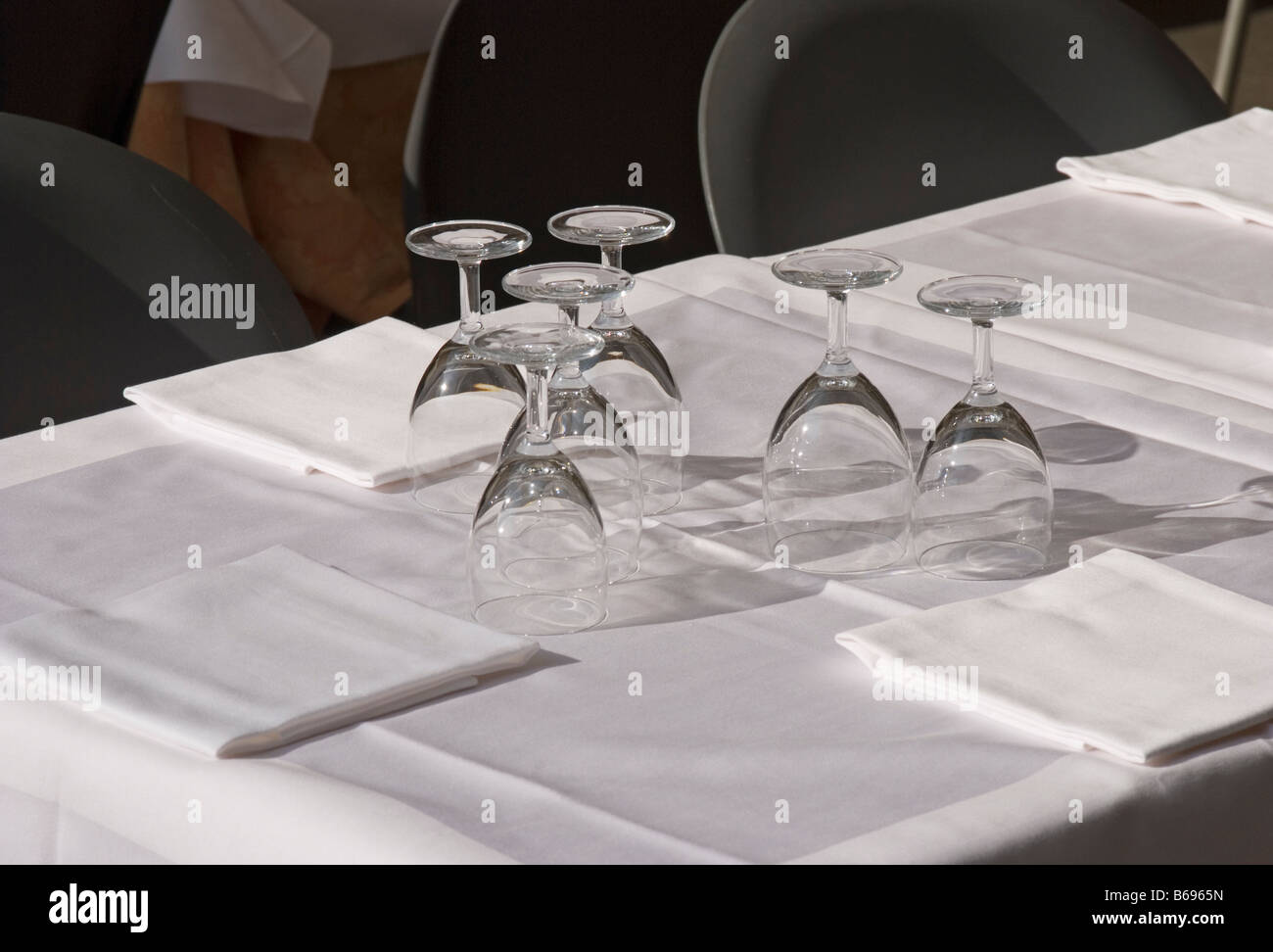 laid out table in restaurant Stock Photo - Alamy