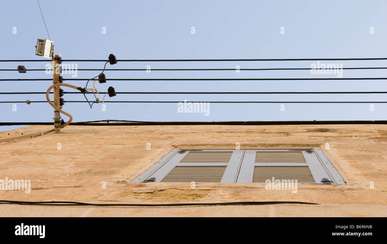 Powerline and window, Marsaxlokk Malta Stock Photo - Alamy