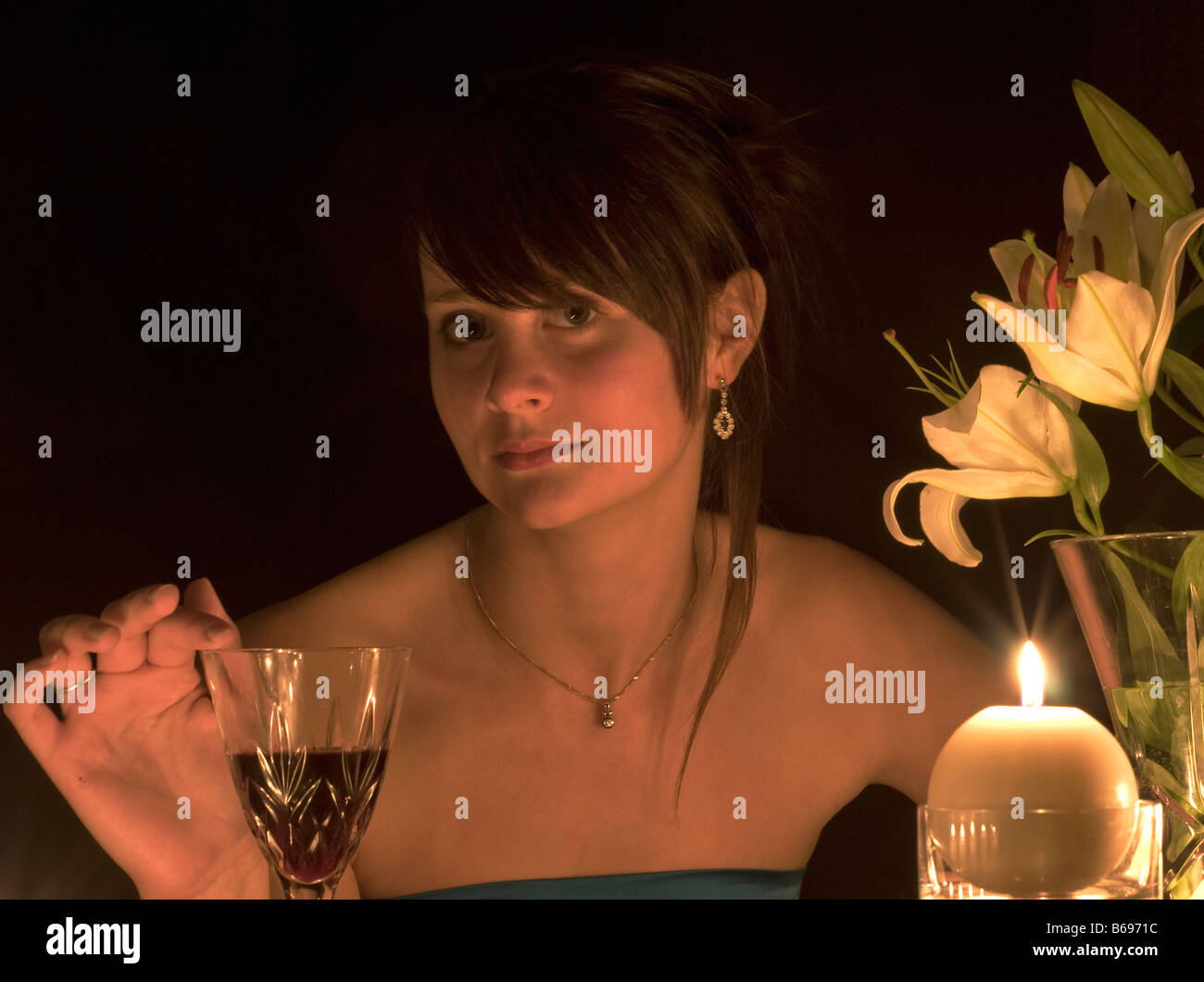 A young woman by candlelight Stock Photo - Alamy